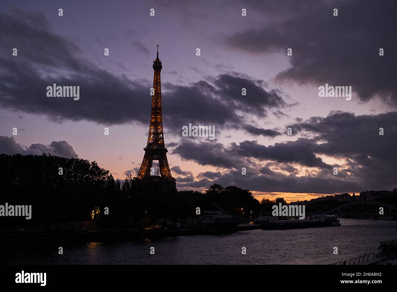 The Iconic Eiffel Tower with Lights on at Dusk or Night - View from ...