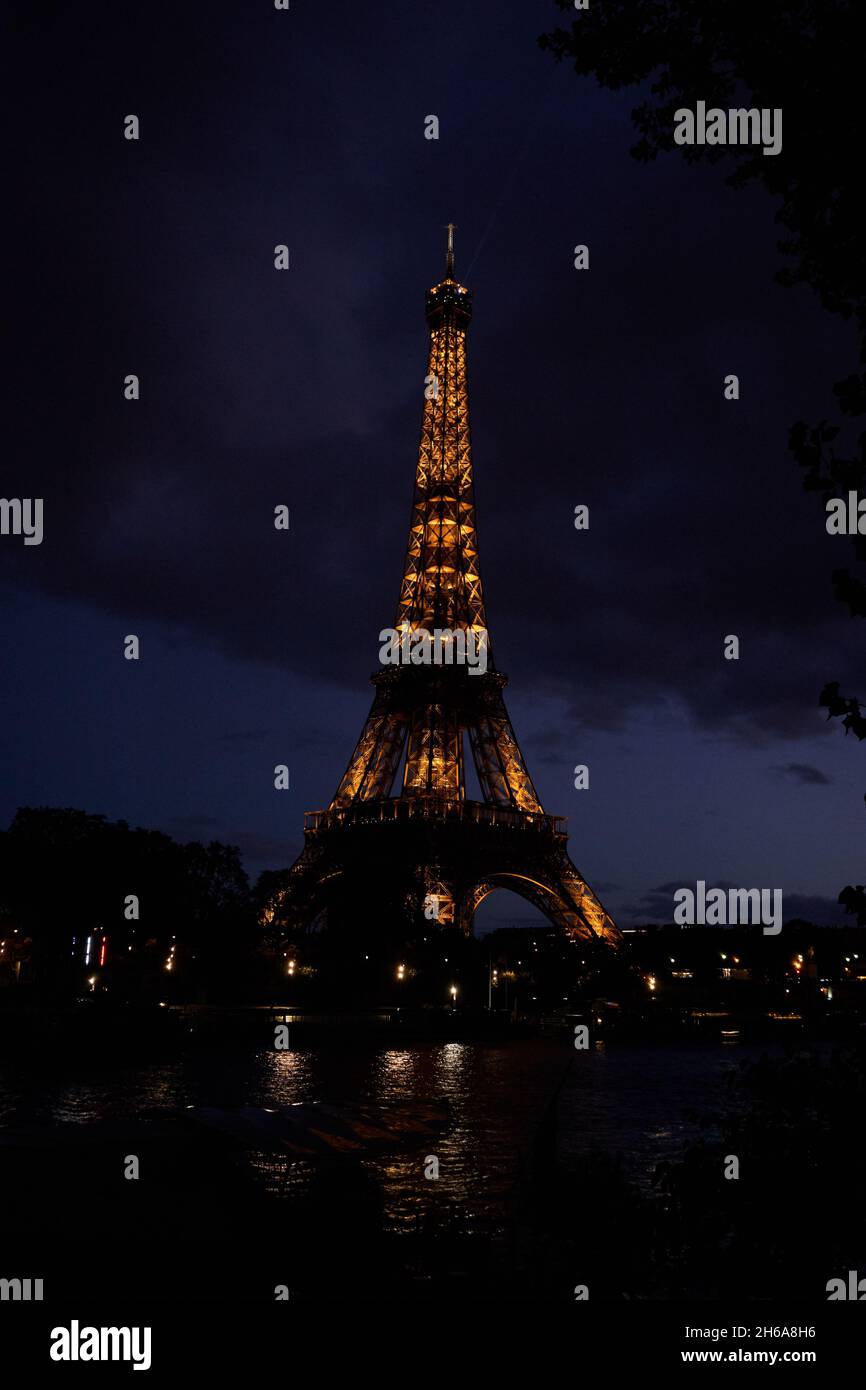The Iconic Eiffel Tower with Lights on at Dusk or Night - View from ...