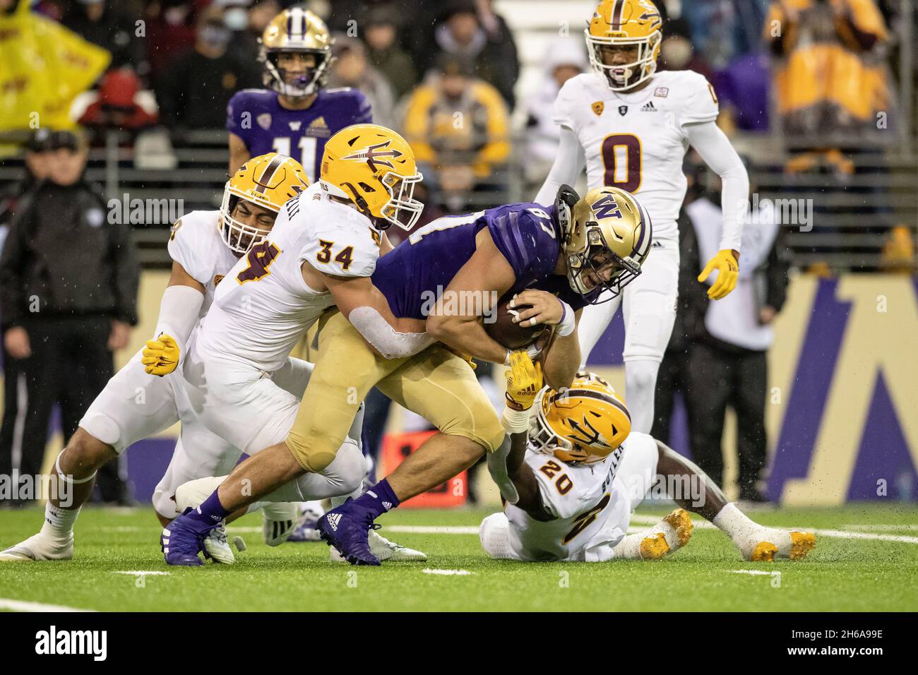 Washington Huskies tight end Cade Otton (87) drives forward for extra ...