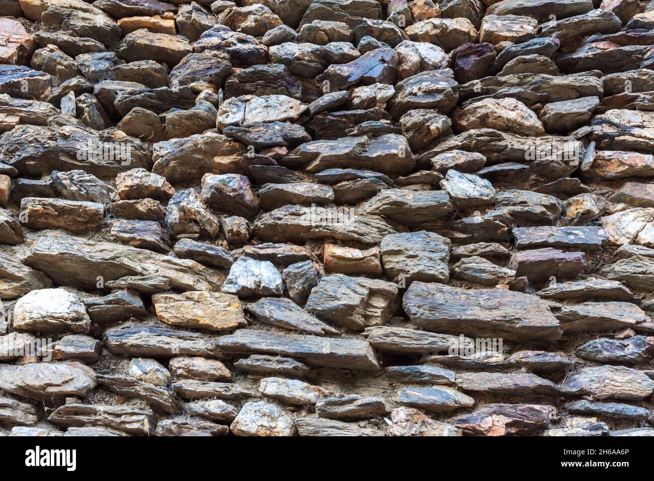 Wall of stones and mud, typical of high mountain houses in Sierra ...