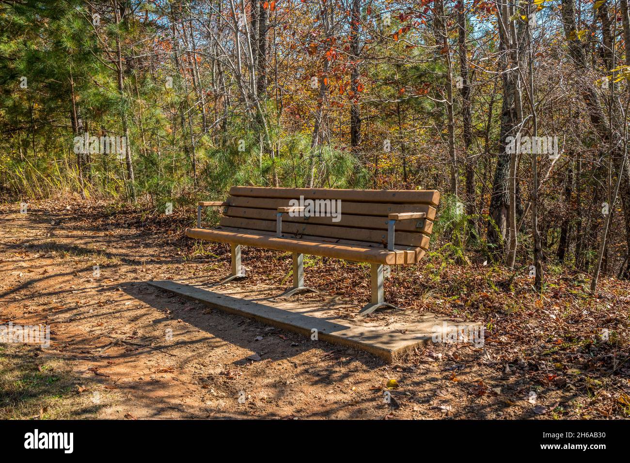 Heavy duty bench bolted to a cement pad along the hiking trail in the ...