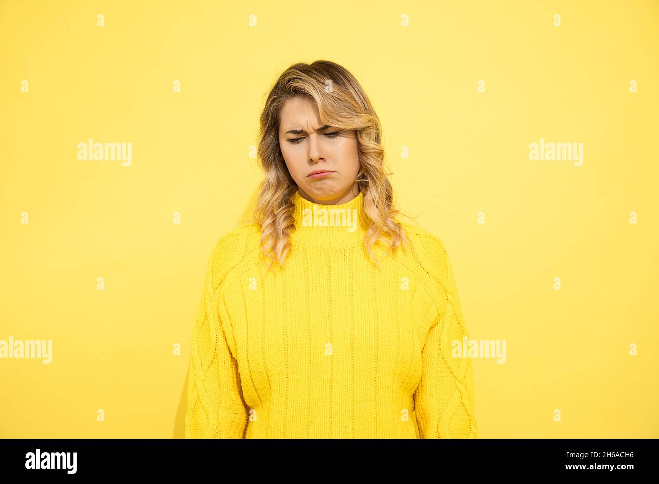 Upset young woman on yellow background, sadness, upset sad female ...