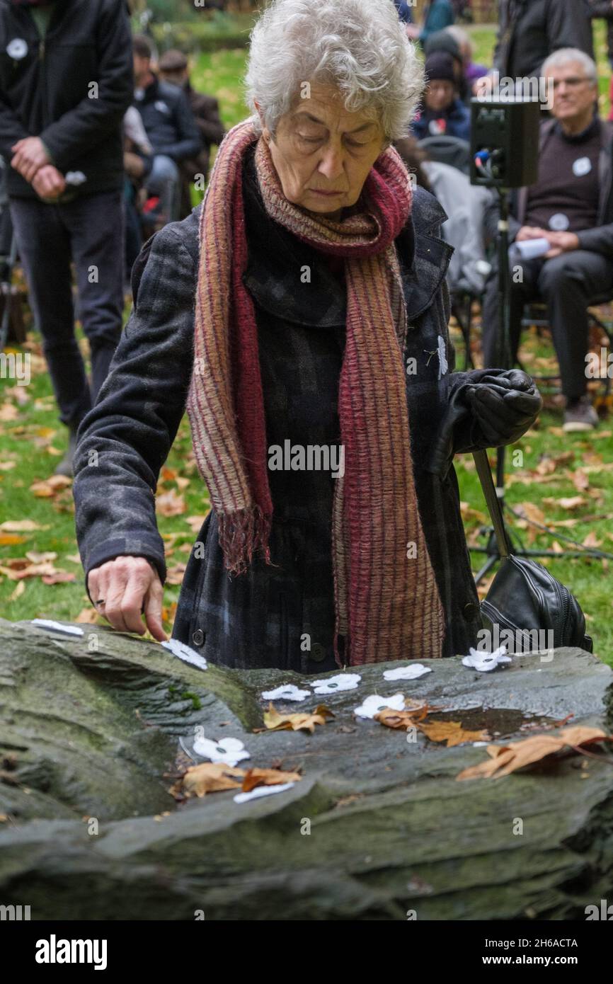 London, UK. 14th Nov 2021. Laying white poppies on the memorial to ...
