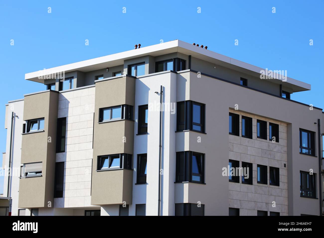 Modern apartment building in urban style Stock Photo - Alamy