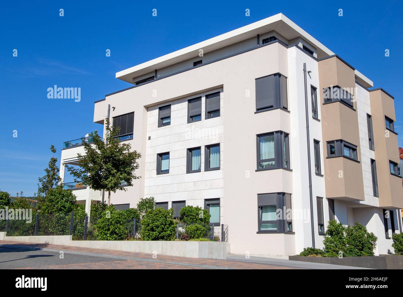 Modern apartment building in urban style Stock Photo - Alamy