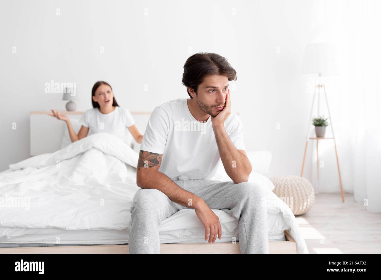 Sad Upset Caucasian Millennial Husband Ignoring Angry Wife Lady