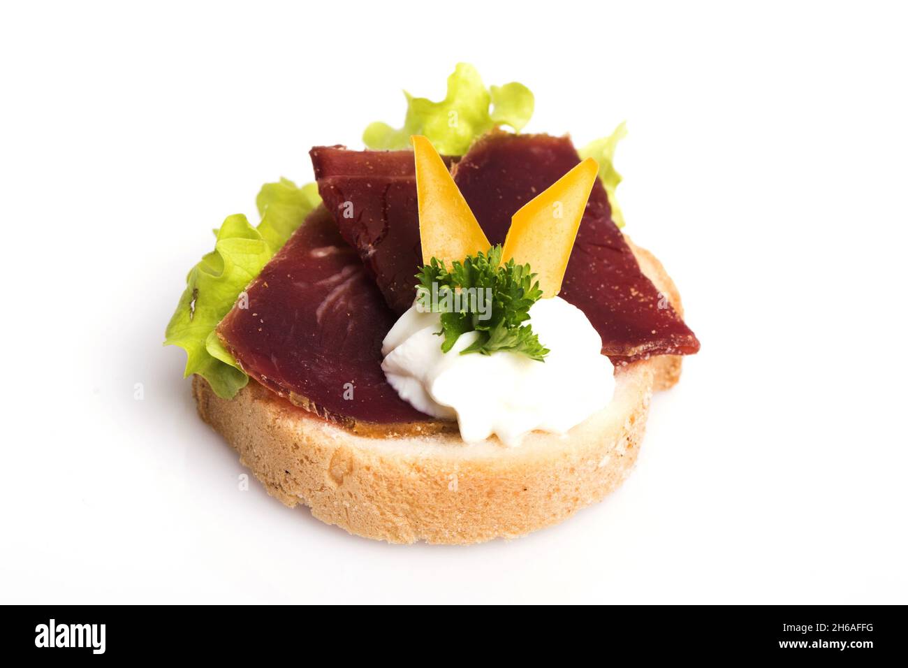 Delicious canapes with feta cheese, strawberries, black sesame, and ...
