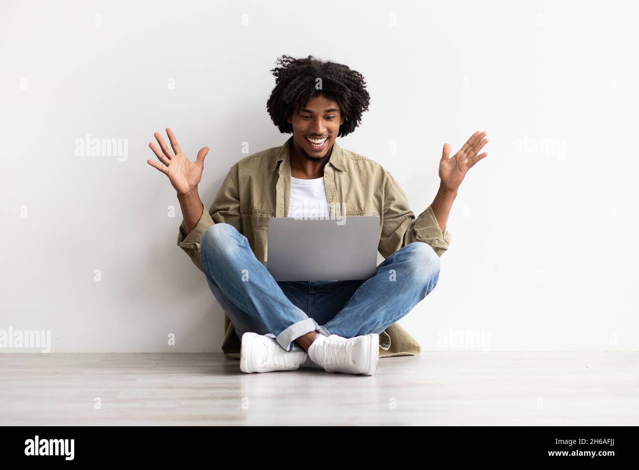Online Success. Surprised Young Black Guy Looking At Laptop Computer ...