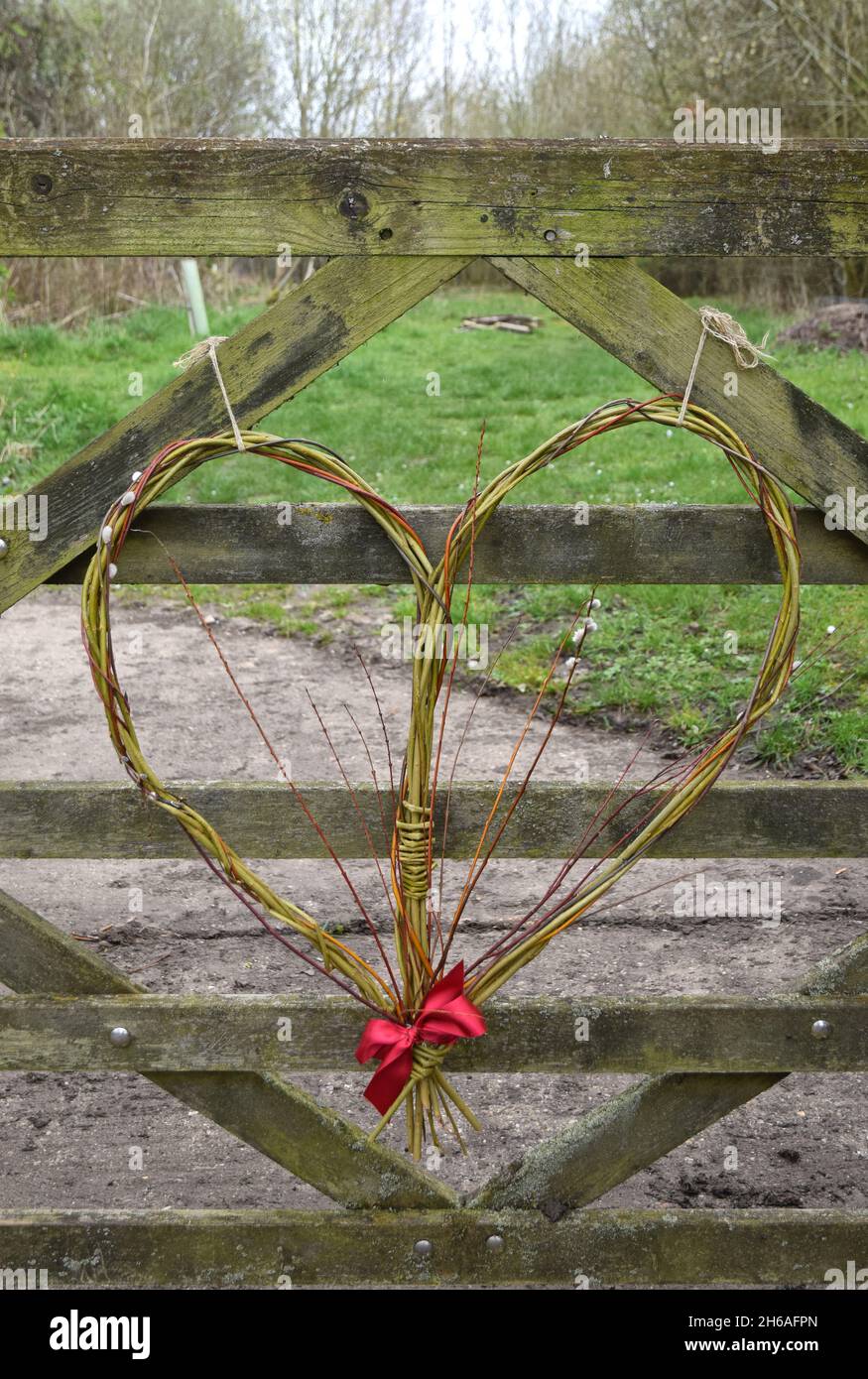 willow heart on five-bar gate Stock Photo - Alamy