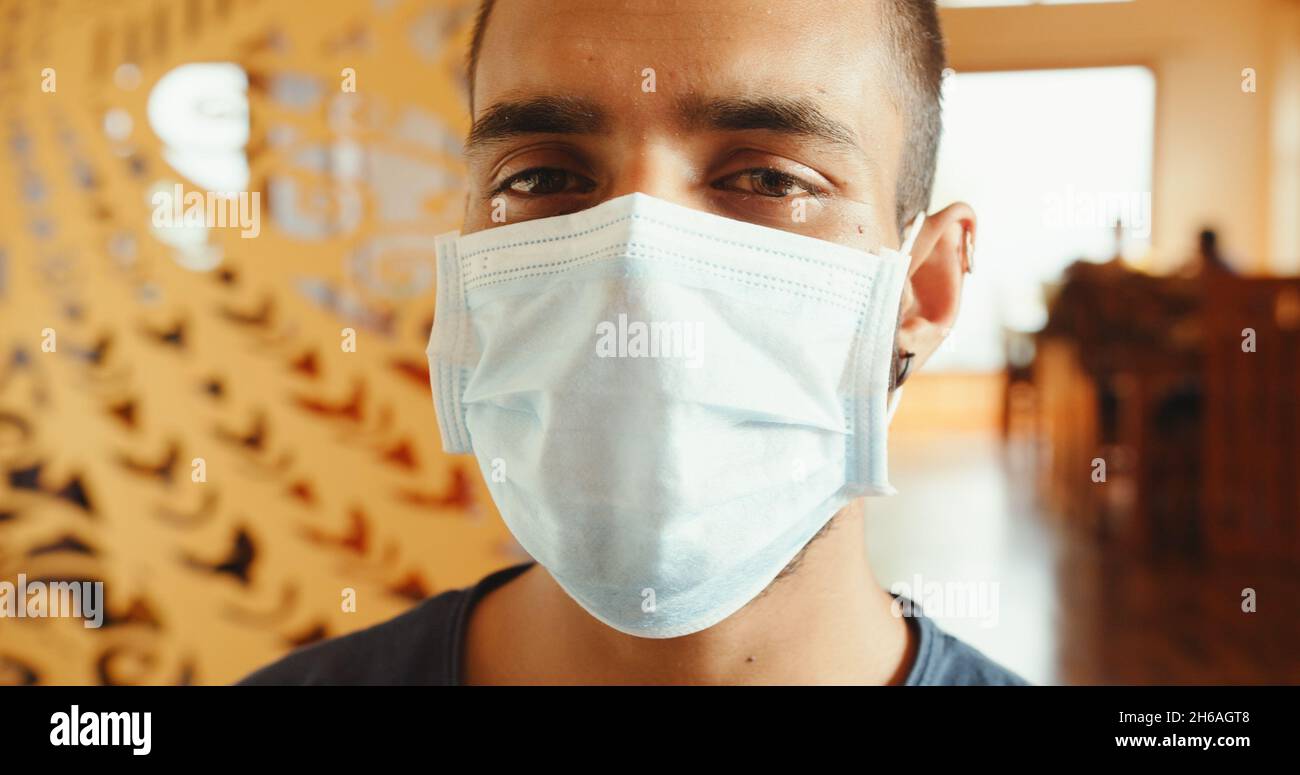 A young Indian guy with a face mask on Stock Photo - Alamy