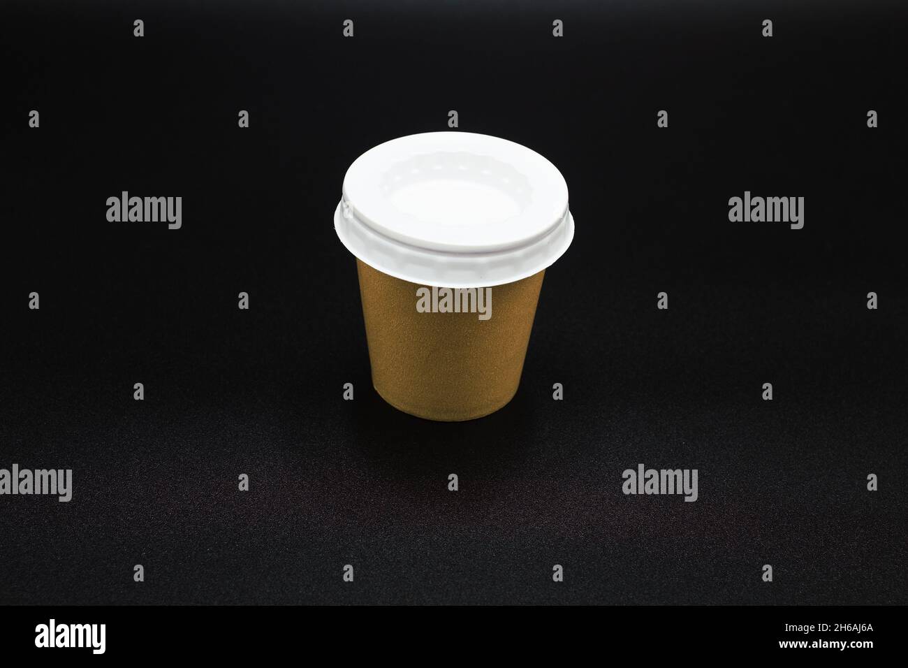Side view of a coffee to go cup with a black background Stock Photo - Alamy