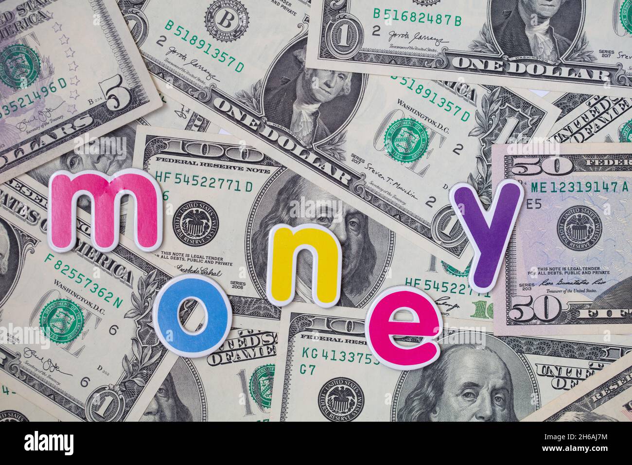 money colorful inscription on US dollar banknotes Stock Photo - Alamy
