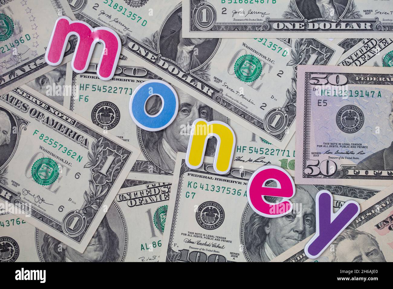 money colorful inscription on US dollar banknotes Stock Photo - Alamy