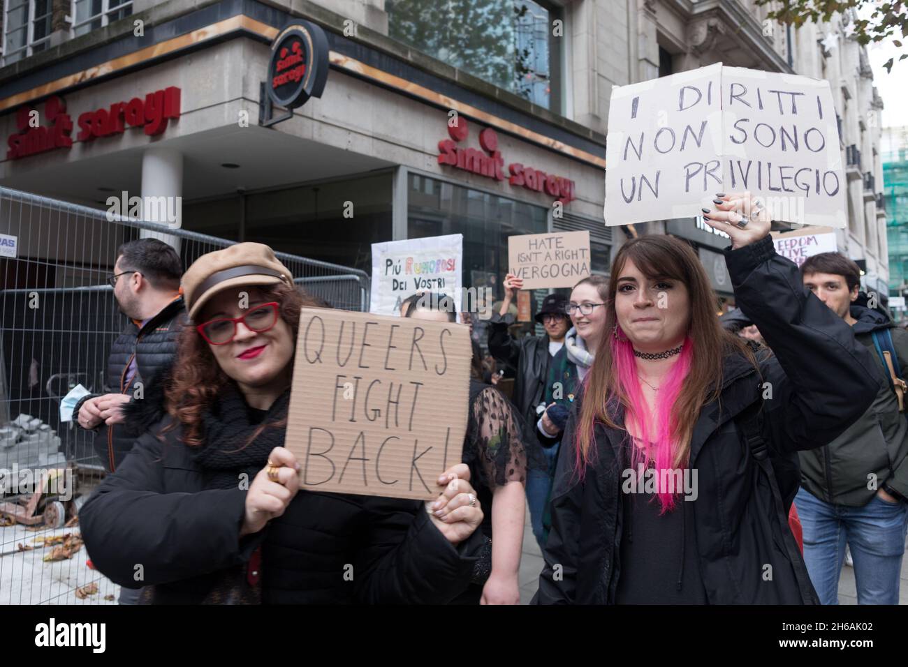 London, UK. 14th Nov, 2021. Protestors seen raising placards that read ...
