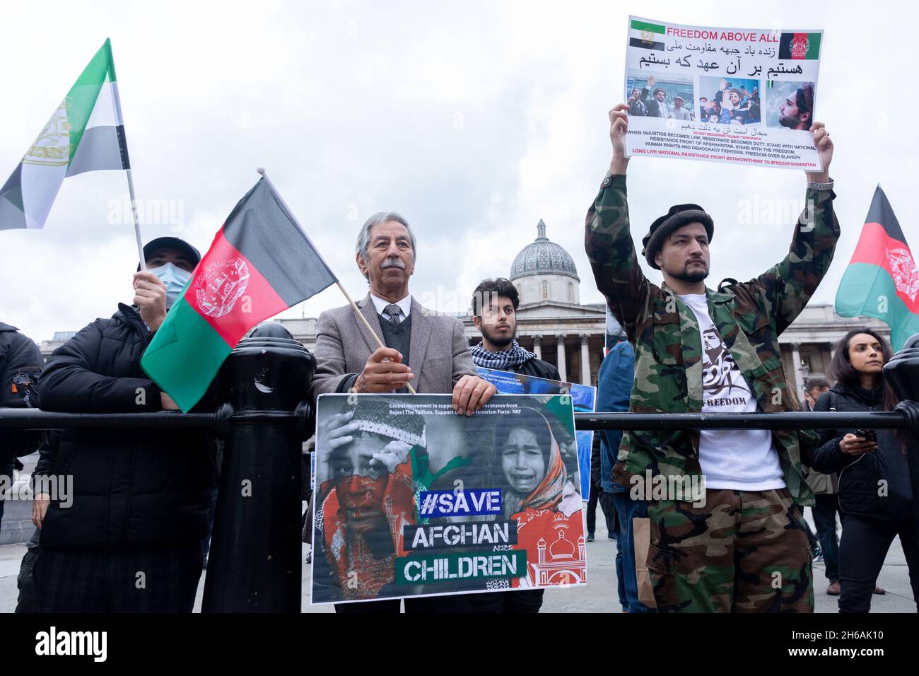 London, UK. 14th Nov, 2021. Protestors wave the Afghan flag and hold ...