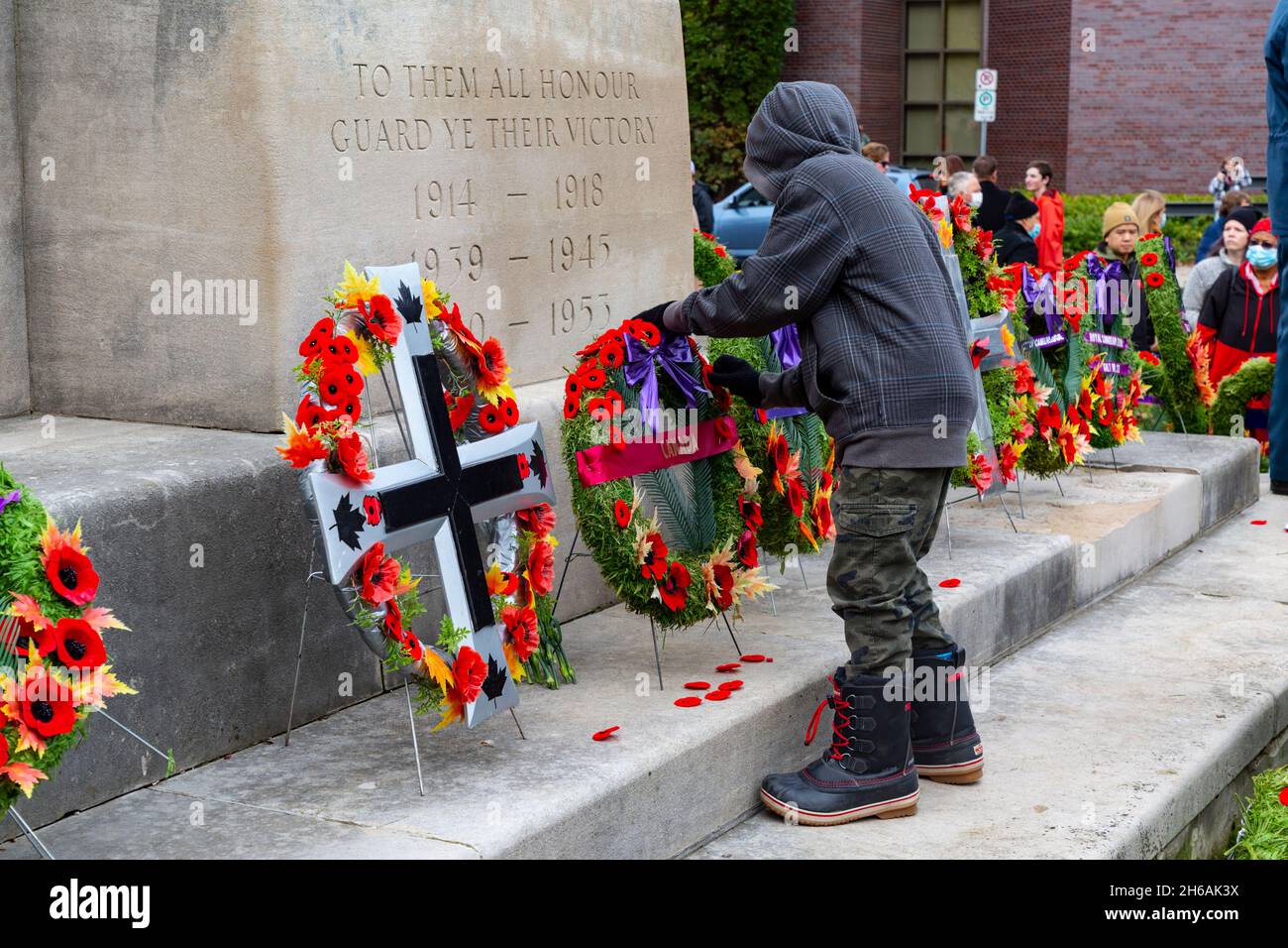 People place their poppies and pay their respects at the cenotaph ...