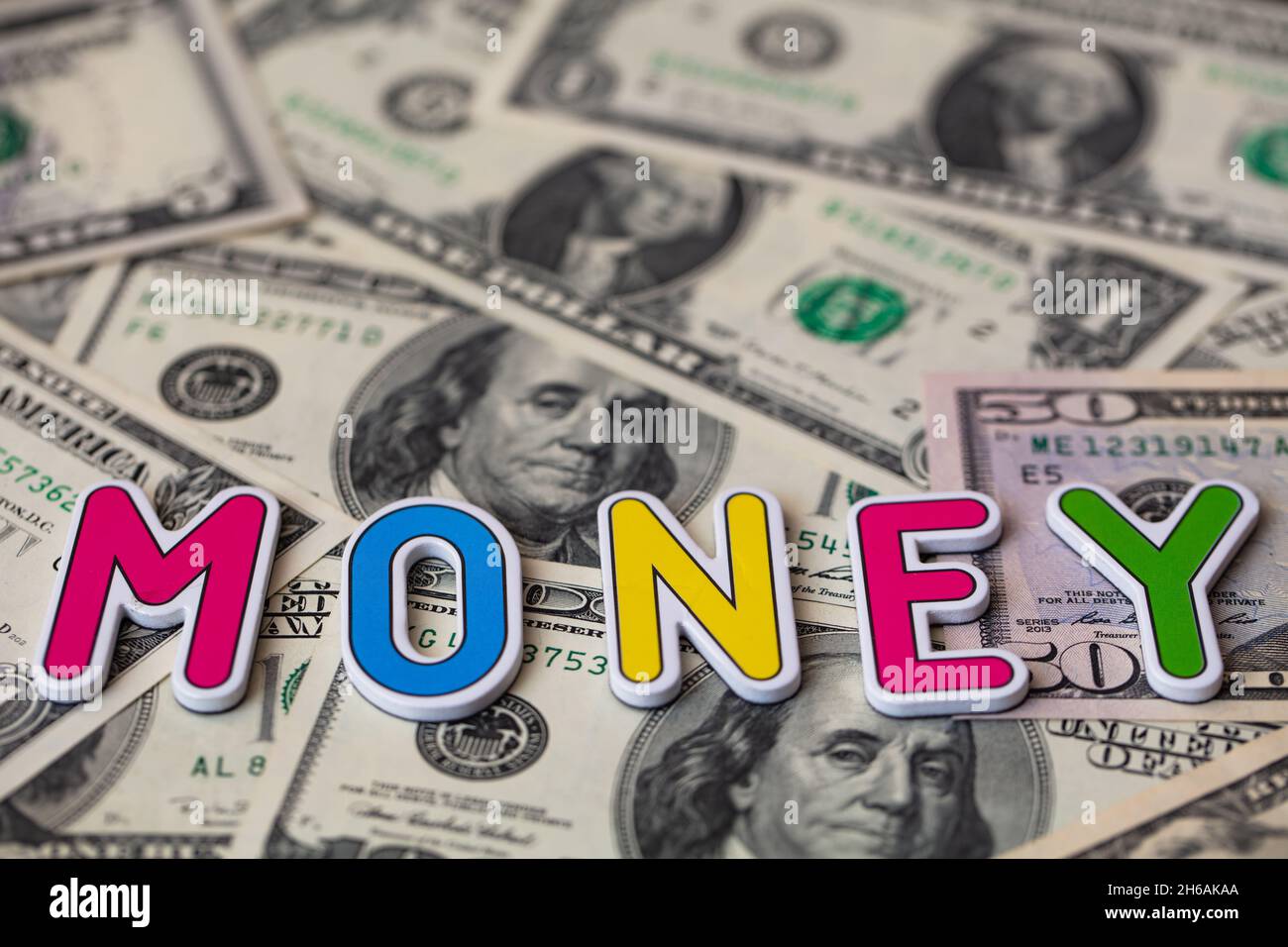 money colorful inscription on US dollar banknotes Stock Photo - Alamy