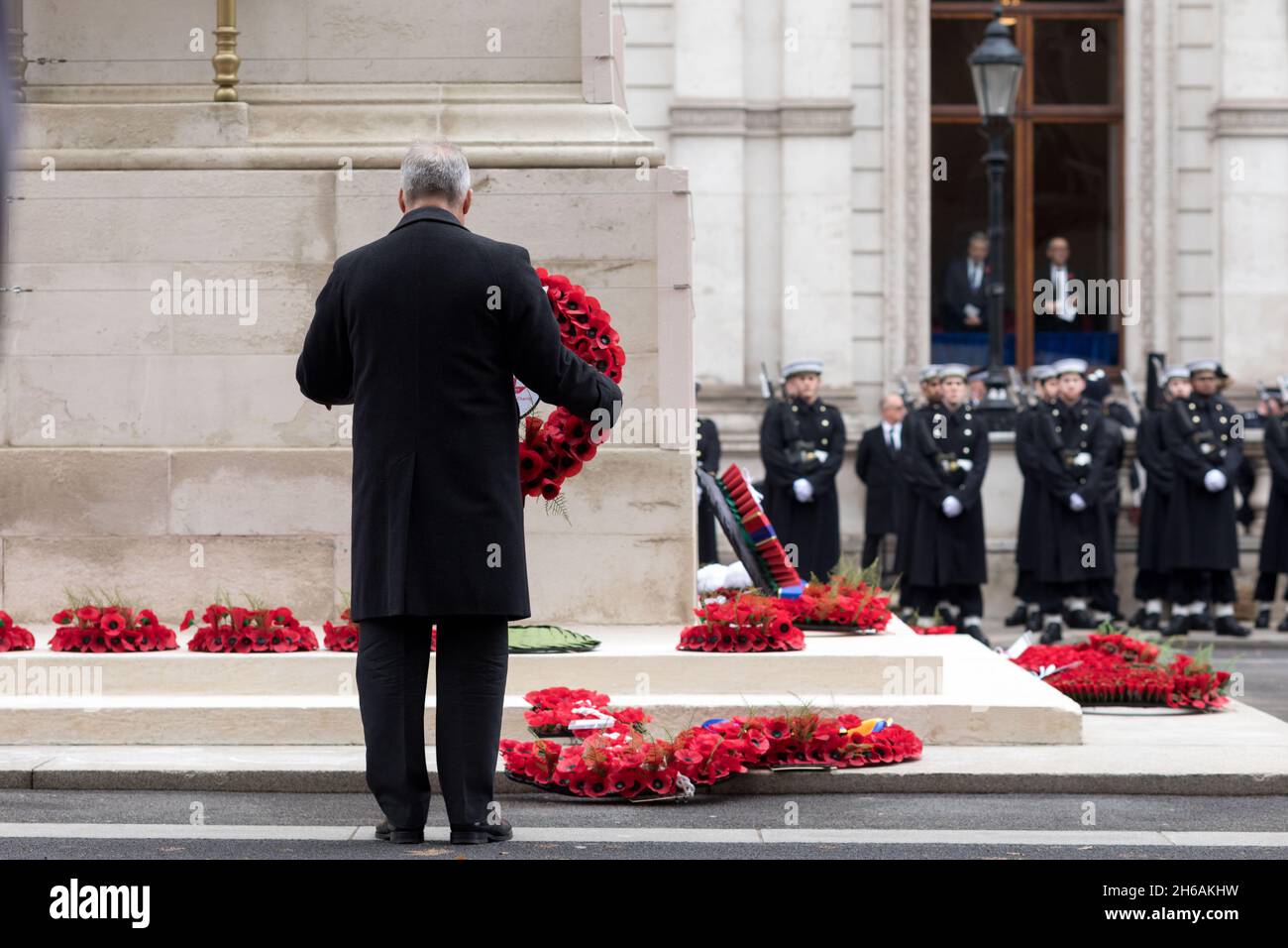 London, UK. 14th Nov, 2021. A dignitary seen laying his poppy wreath on ...