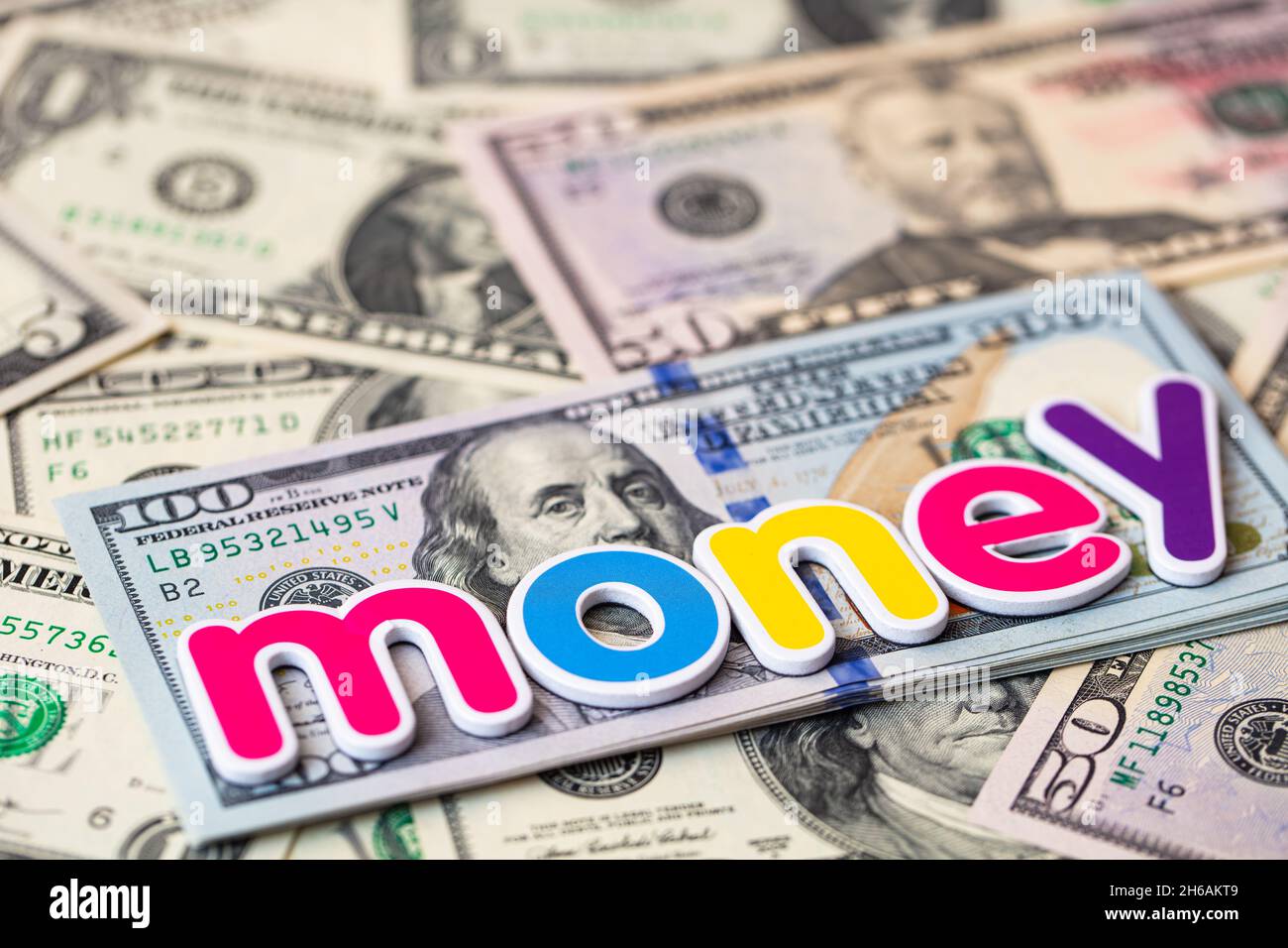 money colorful inscription on US dollar banknotes Stock Photo - Alamy