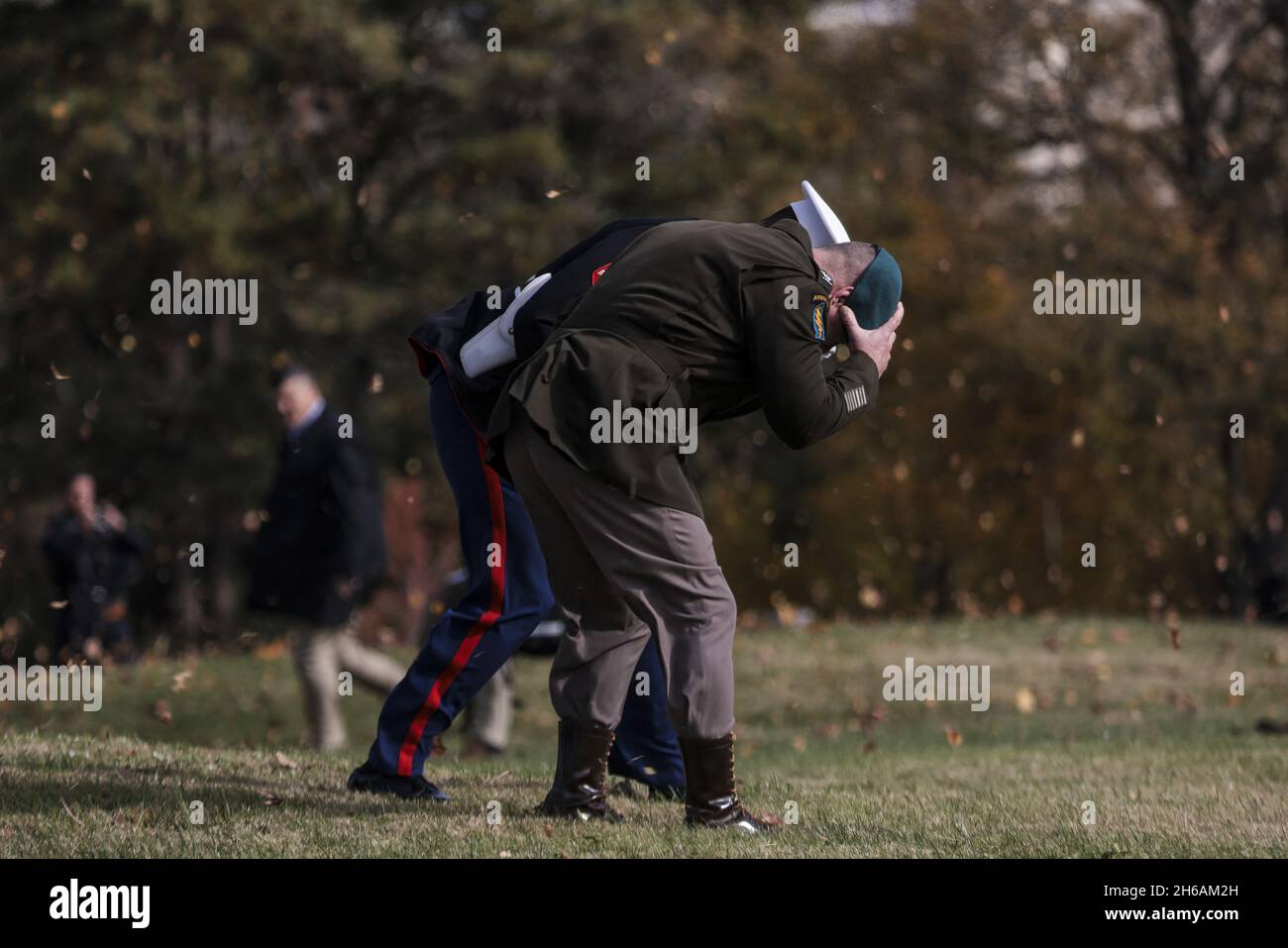 Colonel David D. Bowling next to a Marien, center left, ducks into ...