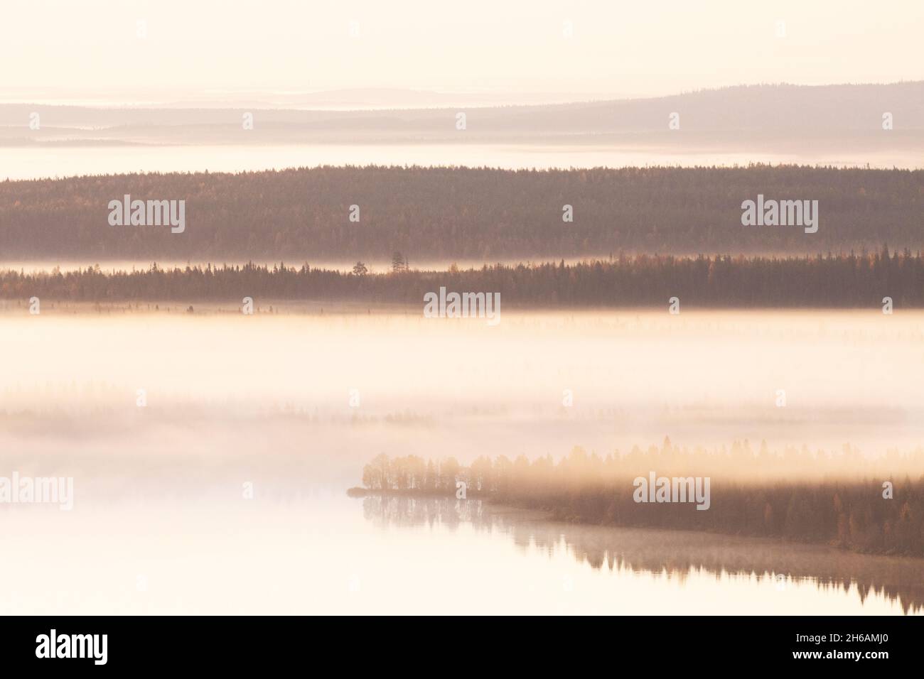 Beautiful fells in fog during a colorful morning in Northern Finland ...
