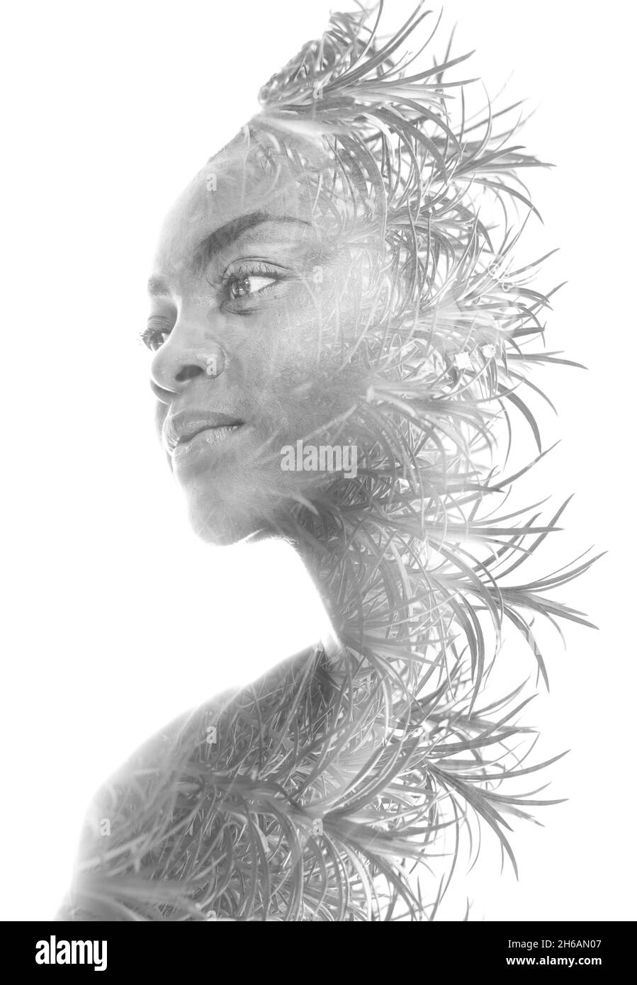 A creative double exposure portrait of a woman combined with leaves ...