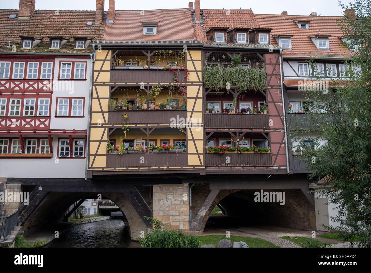 The Kramerbrucke medieval arch bridge (Merchants' bridge) in the city ...