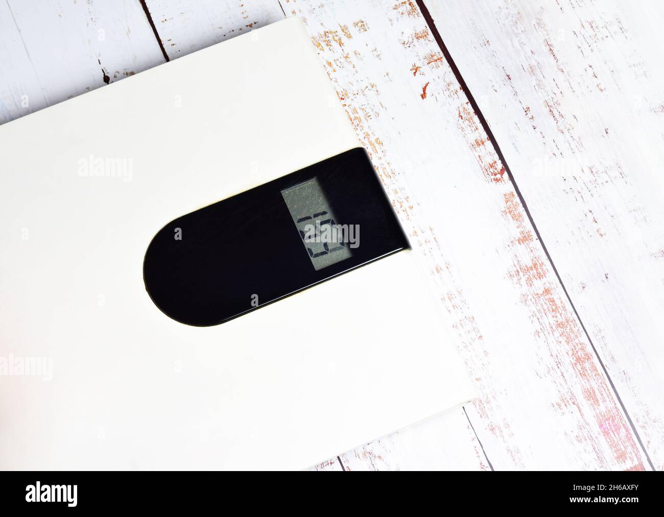 A top view of weighing scales on a wooden floor Stock Photo - Alamy