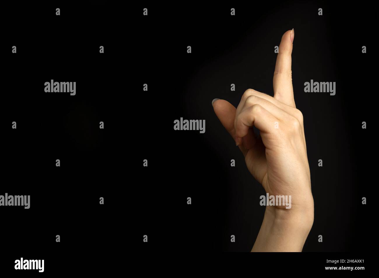 Hand point up. Education concept. Woman hand gesture, pointing sign ...