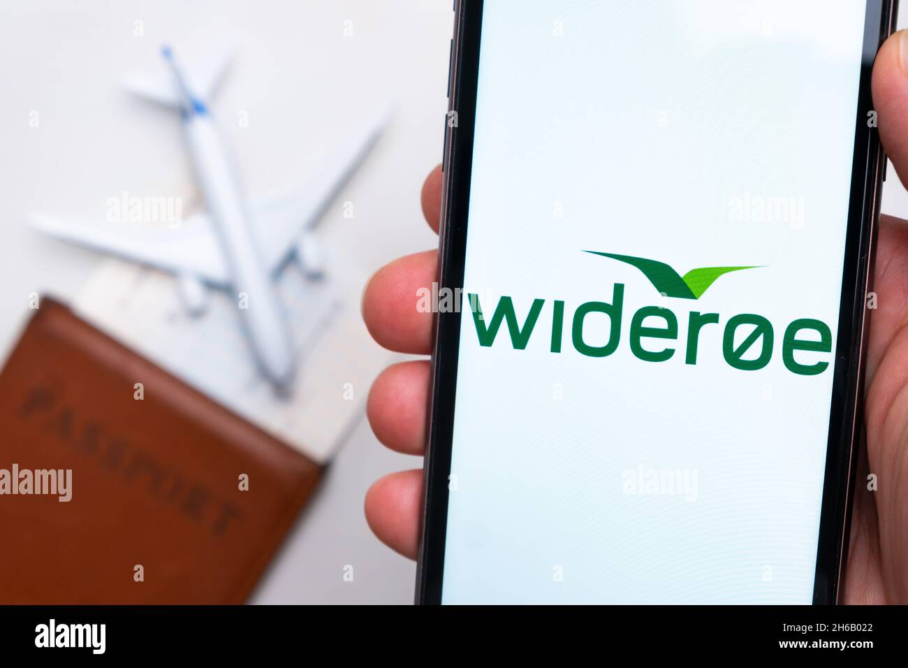 Wideroe airlines company app or logo displayed on a mobile phone with ...