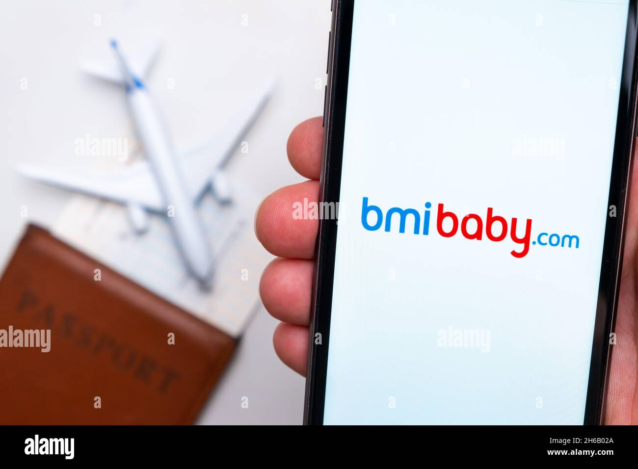 Bmibaby.com airlines company logo on the mobile phone screen in man ...