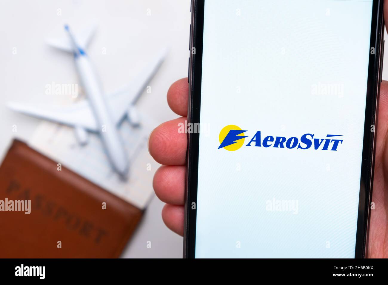 AeroSvit airlines company logo on the mobile phone screen in man hand ...