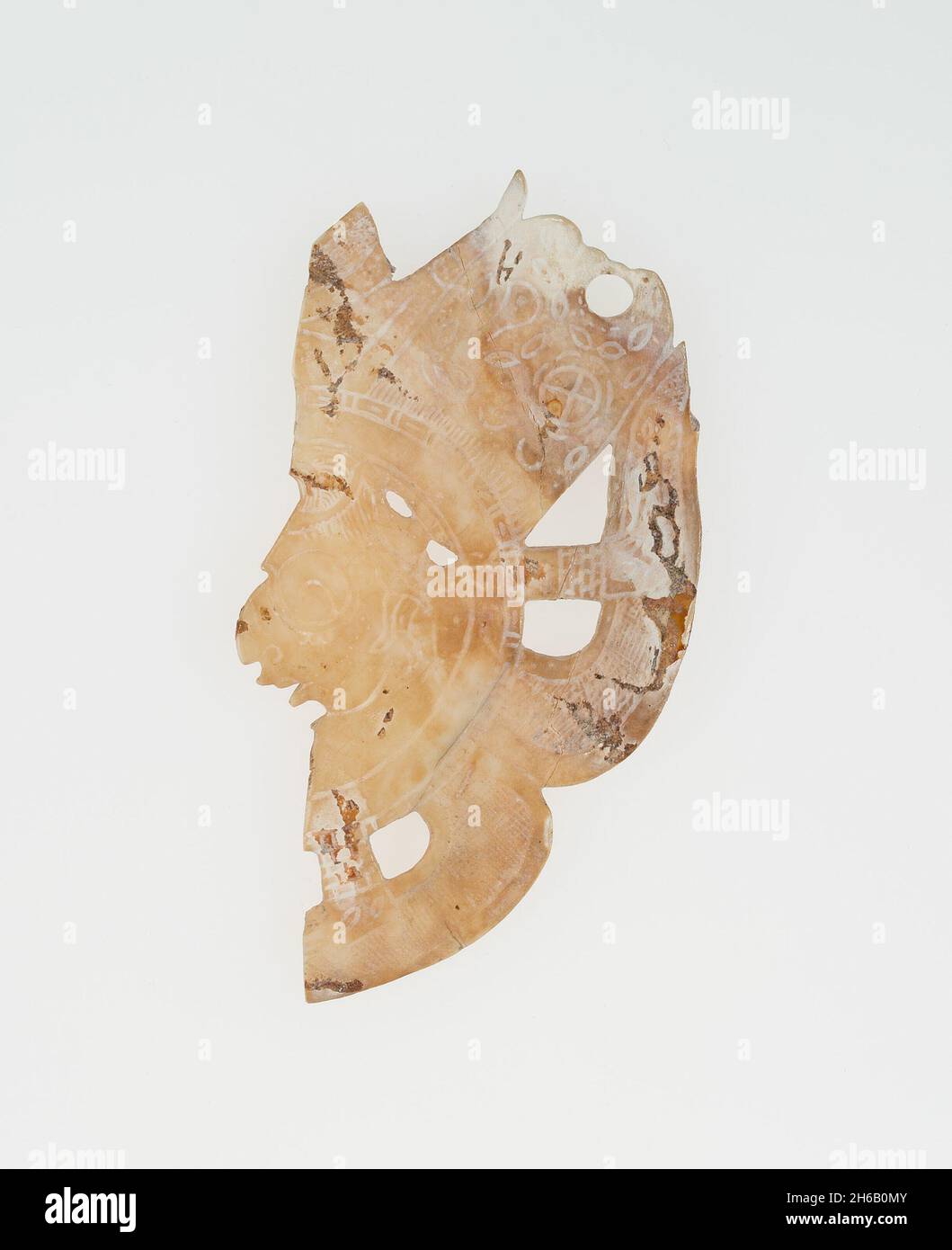 Carved Shell Depicting the Profile Face of Diety (Broken), A.D. 250/900 ...