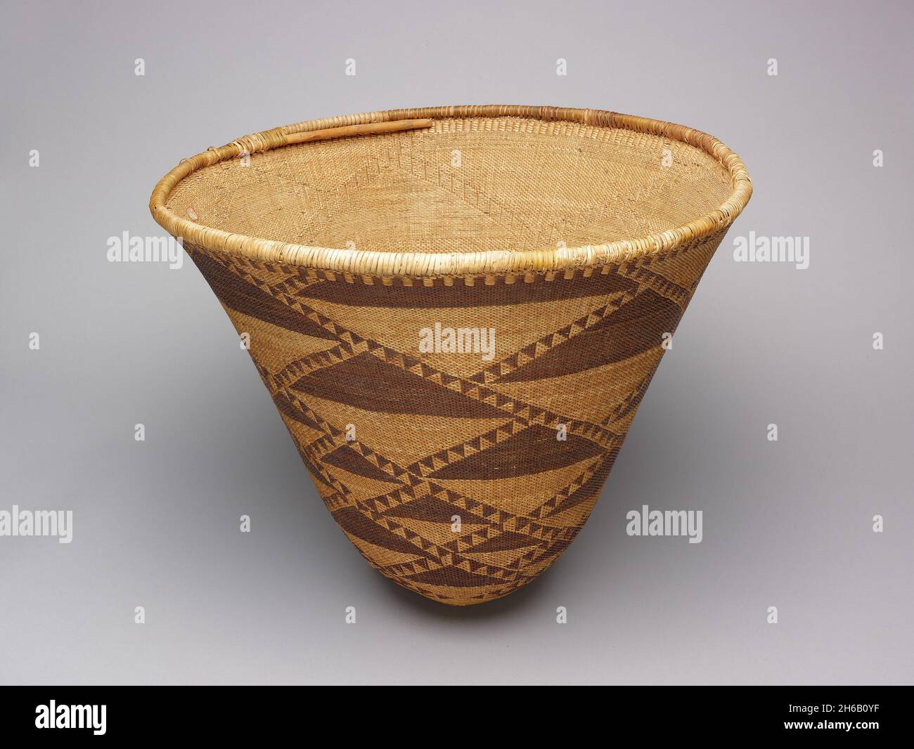 Burden Basket, 1870/80. Large tan woven basket with dark brown ...