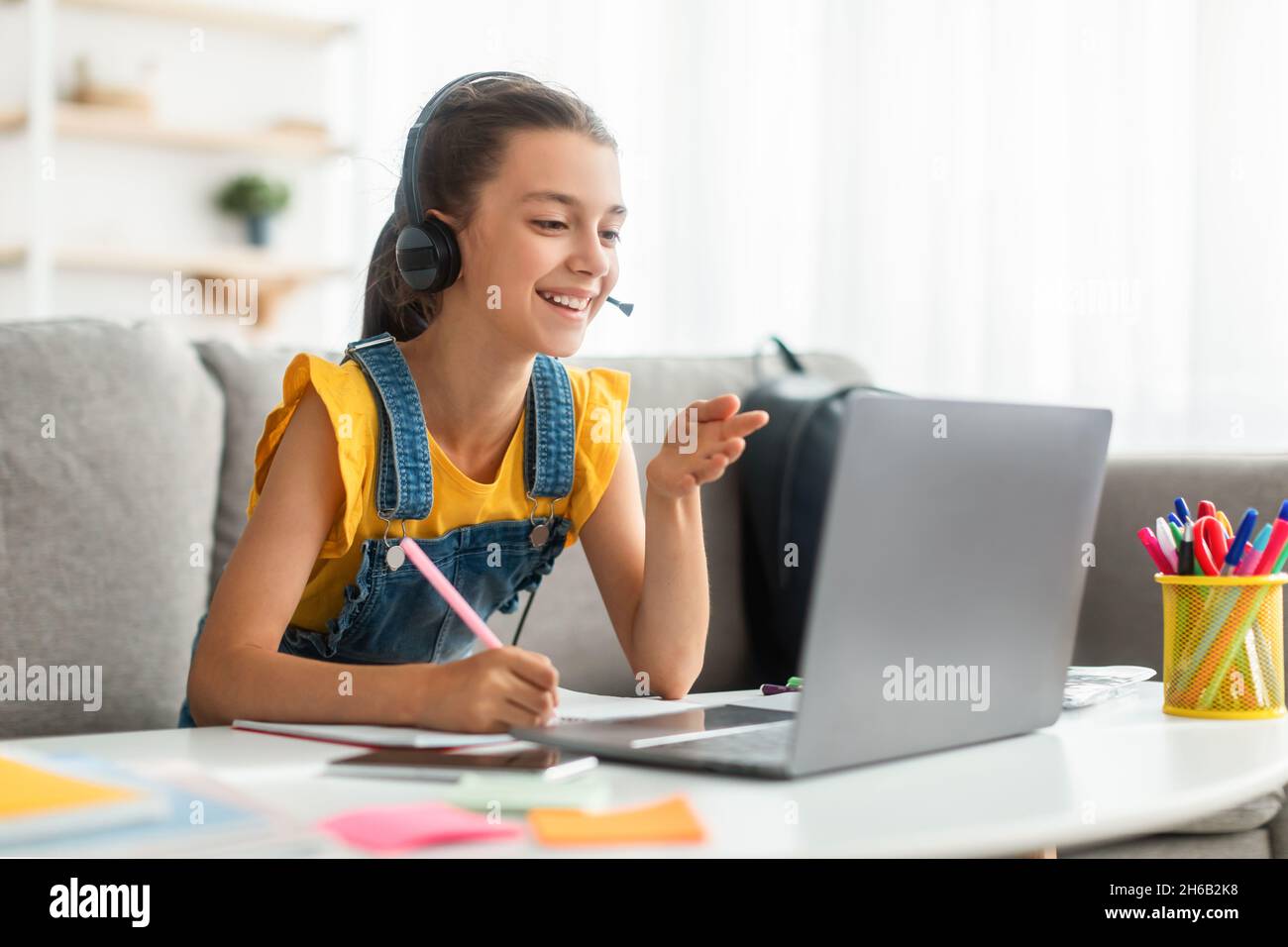 Online Remote Learning. Happy kid using computer having video chat ...