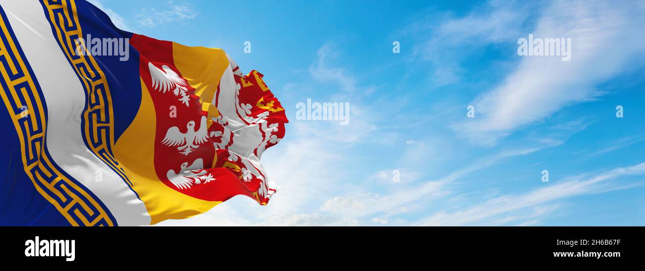 flag of Grand Est, France at cloudy sky background on sunset, panoramic ...
