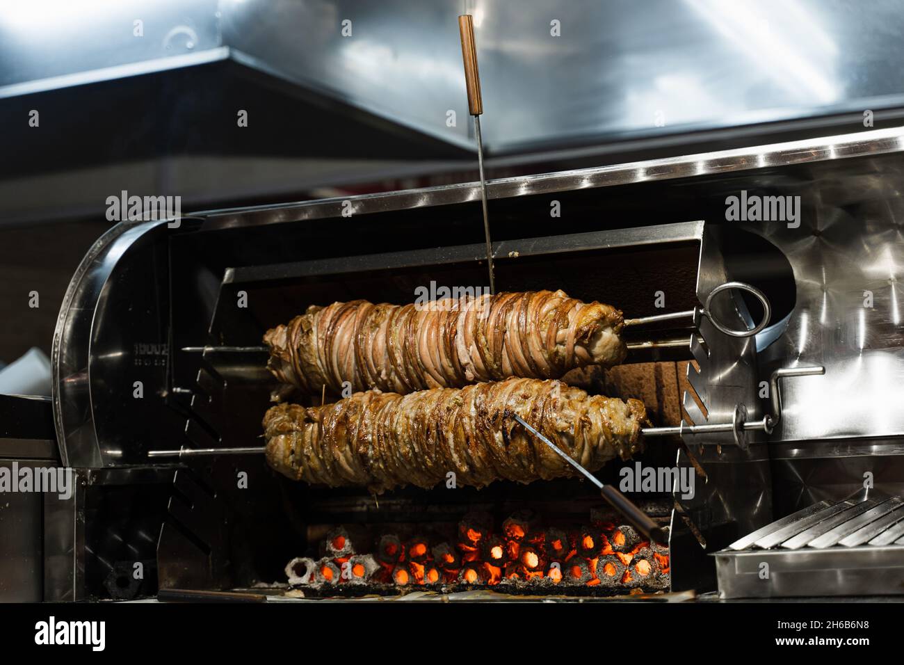 Kokorech lamb intestines roasting in Turkish market. Traditional street ...