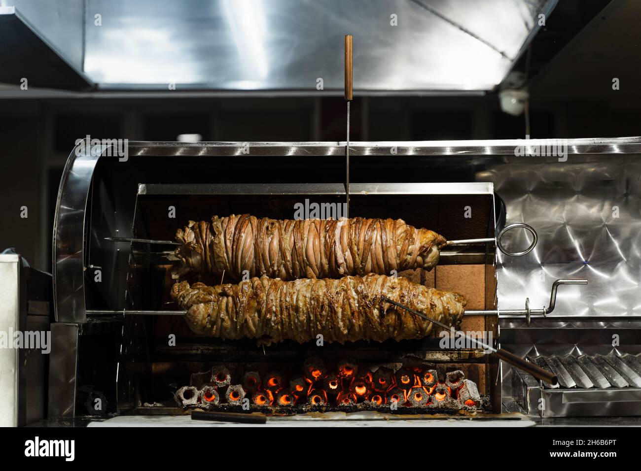 Kokorech lamb intestines roasting in Turkish market. Traditional street ...
