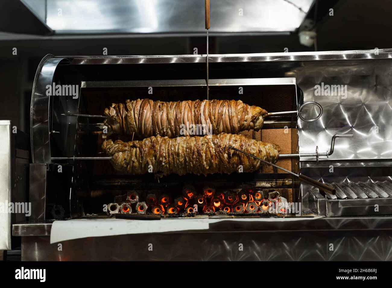 Kokorech lamb intestines roasting in Turkish market. Traditional street ...