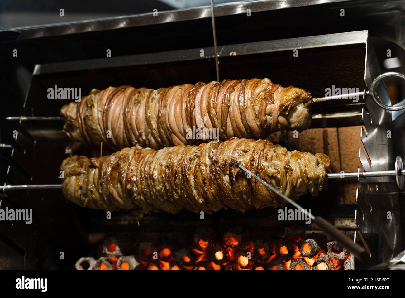 Kokorech lamb intestines roasting in Turkish market. Traditional street ...