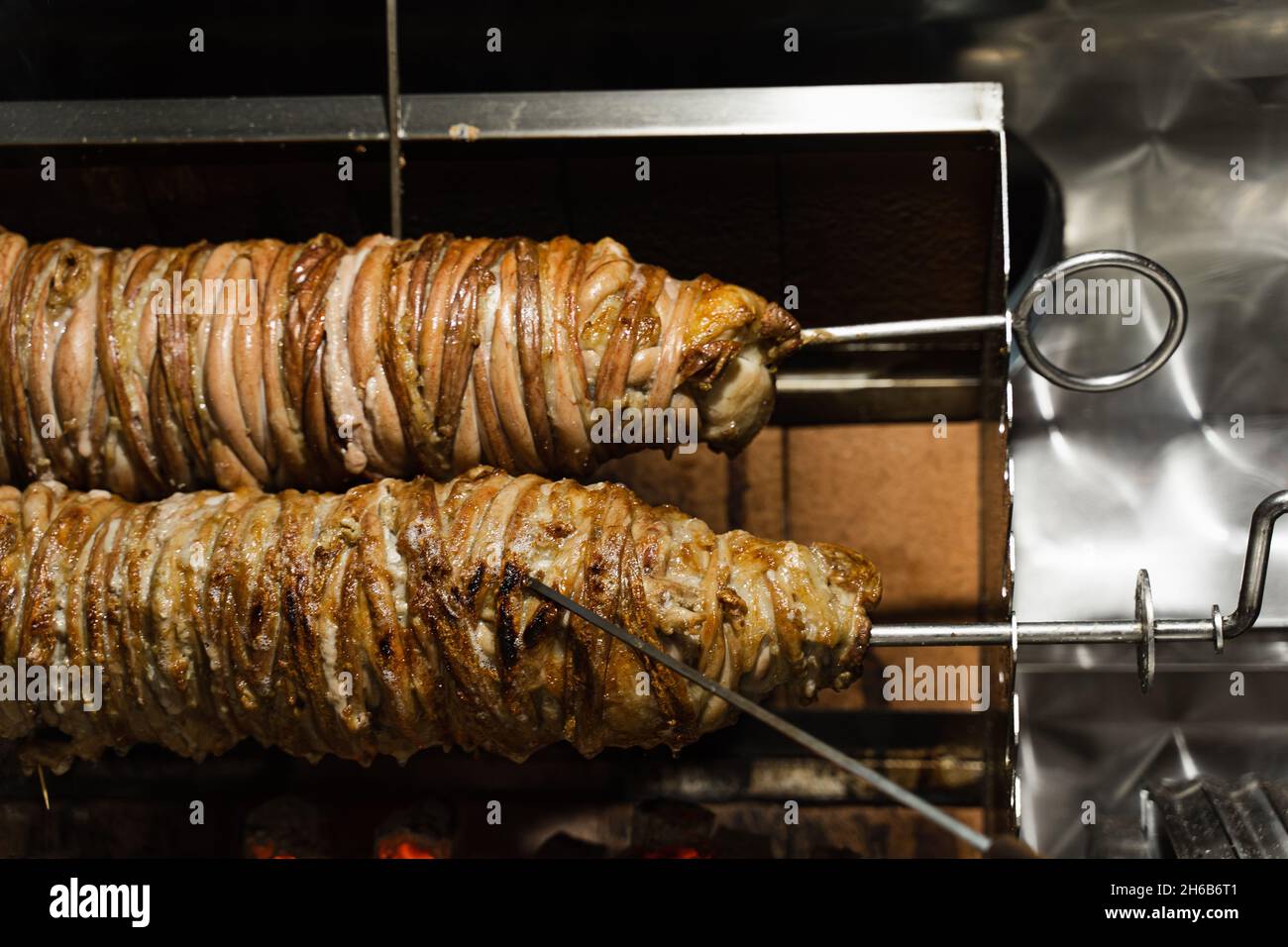 Kokorech lamb intestines roasting in Turkish market. Traditional street ...