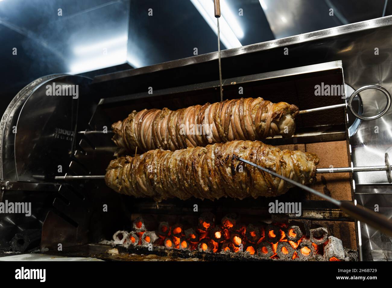 Kokorech lamb intestines roasting in Turkish market. Traditional street ...
