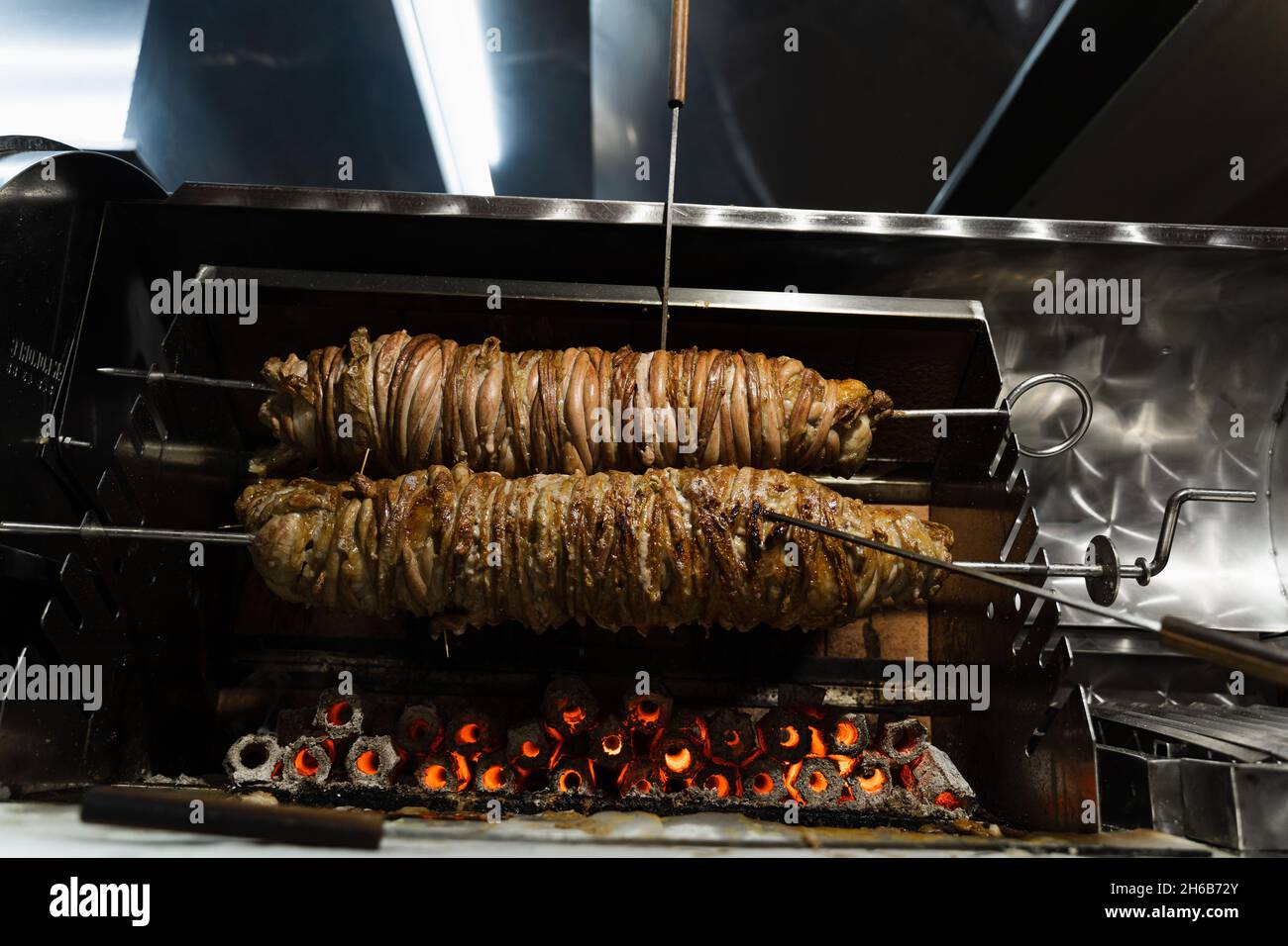 Kokorech lamb intestines roasting in Turkish market. Traditional street ...