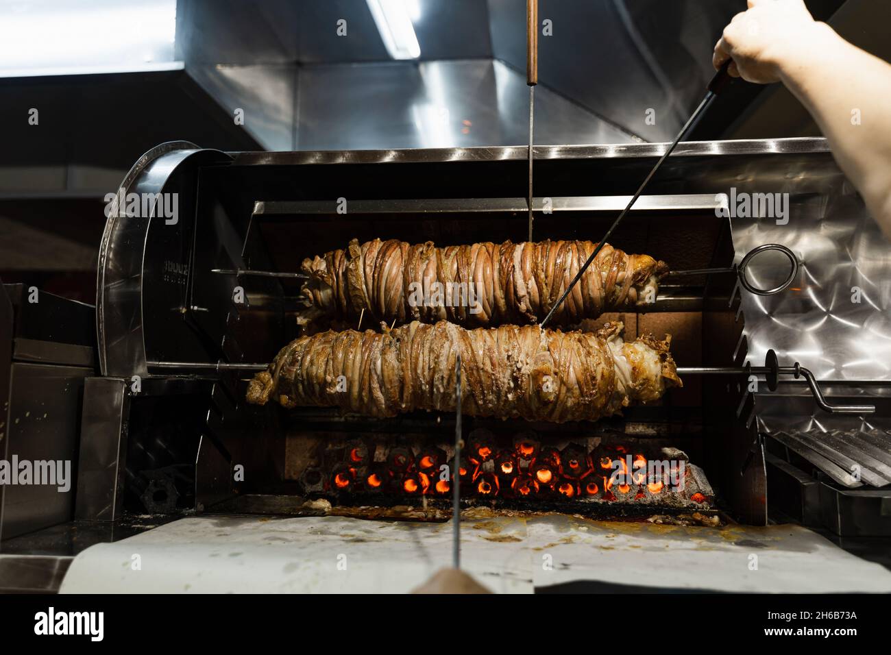 Kokorech lamb intestines roasting in Turkish market. Traditional street ...