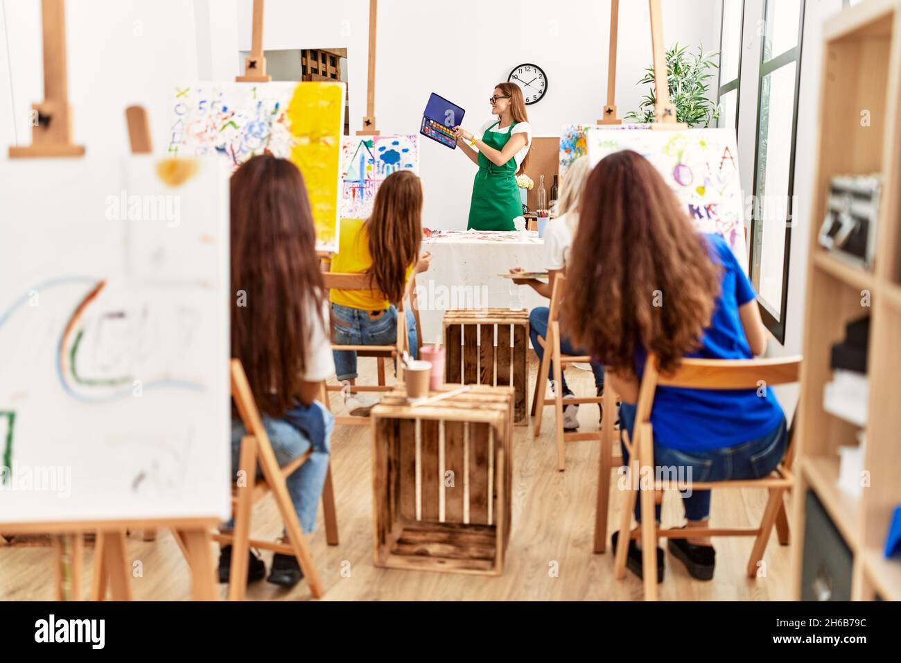 Group of young artist girls having draw lesson at art studio Stock ...