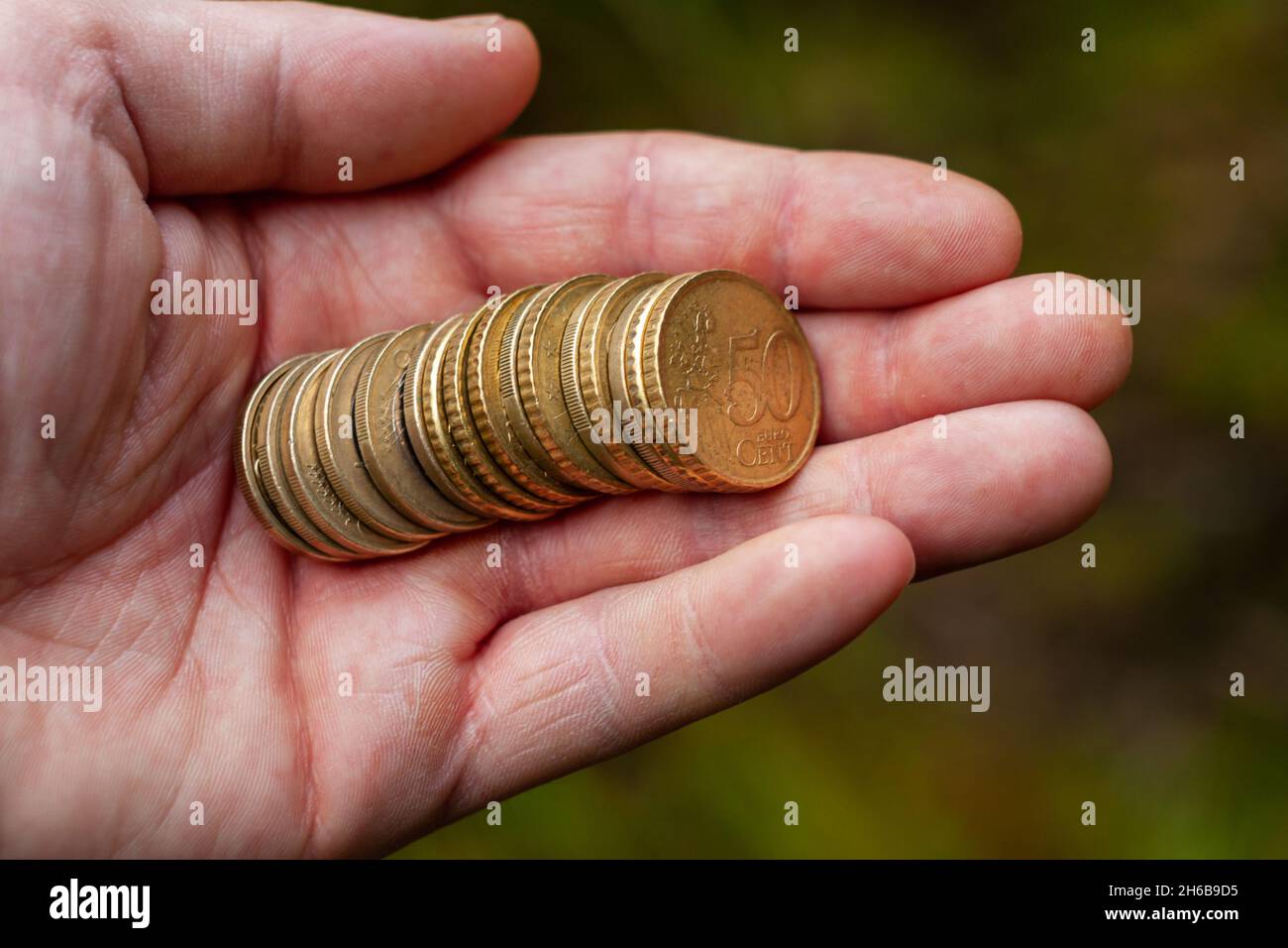 Money in hand. Giving money. Savings Stock Photo - Alamy
