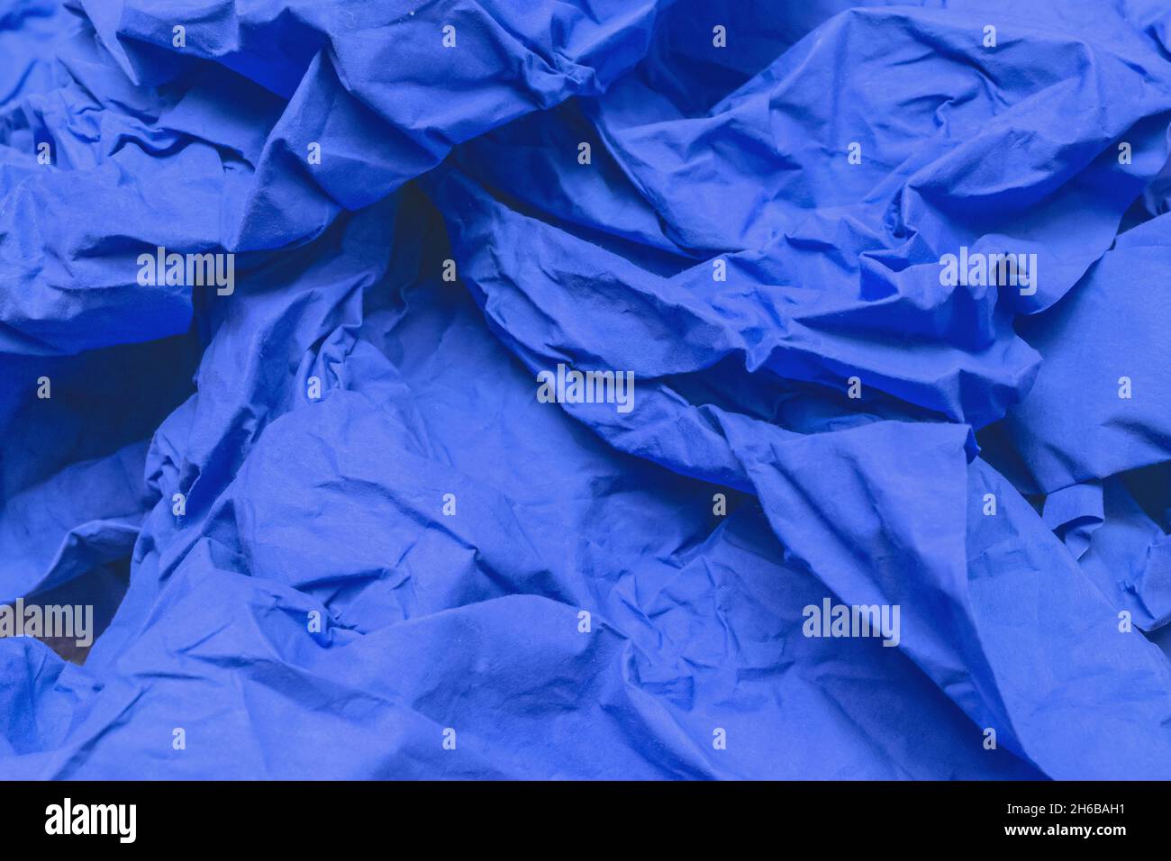 Shreds of old crumpled paper blue close-up background Stock Photo - Alamy