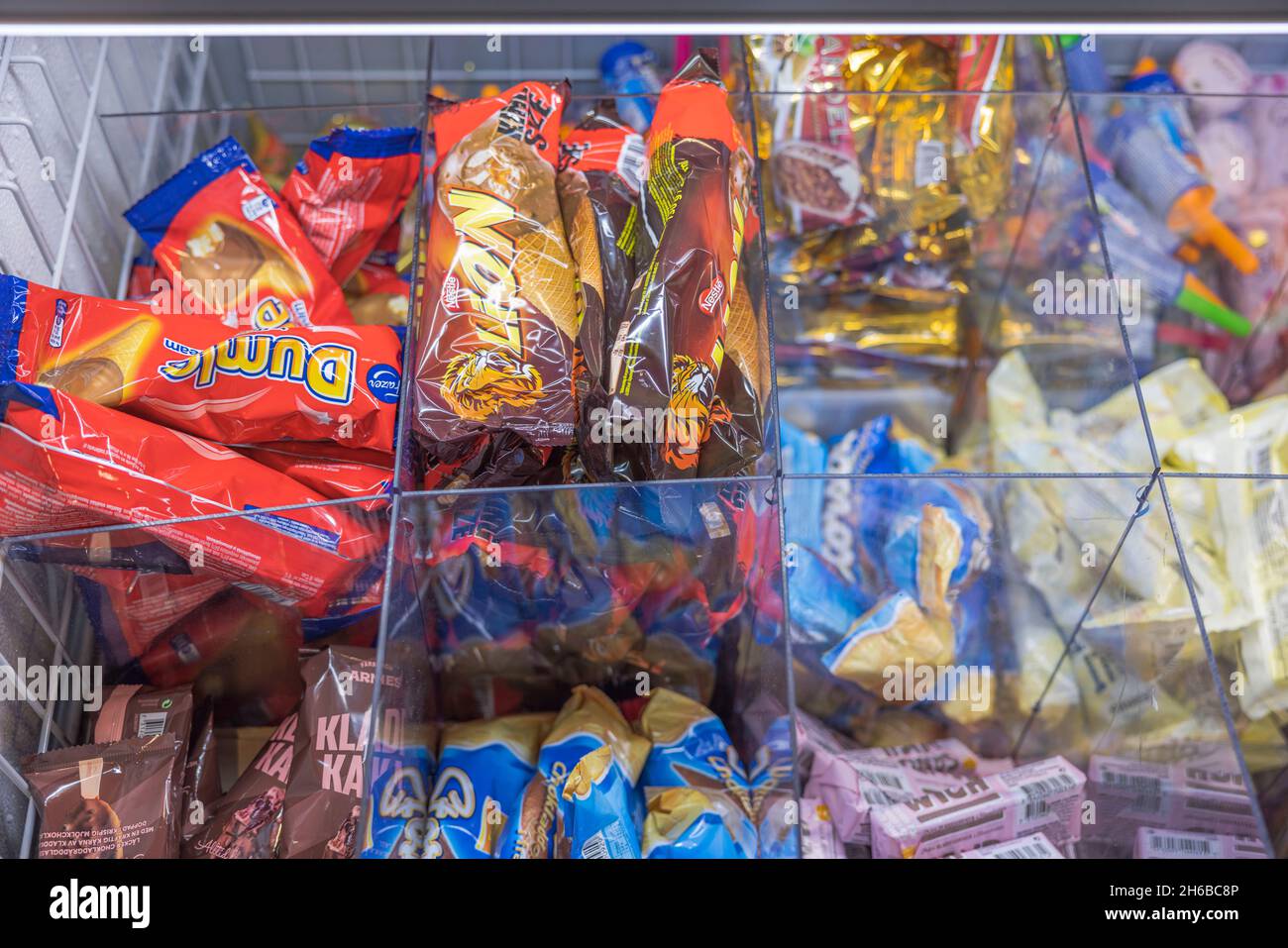 Close up view of different varieties of ice cream lying in freezer in ...