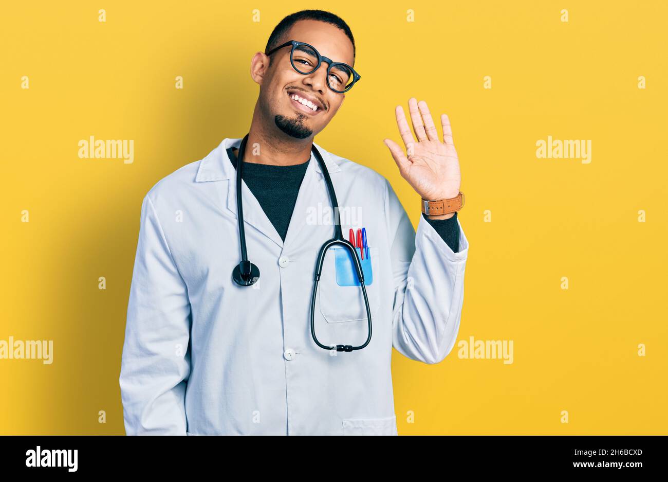 Young african american man wearing doctor uniform and stethoscope ...