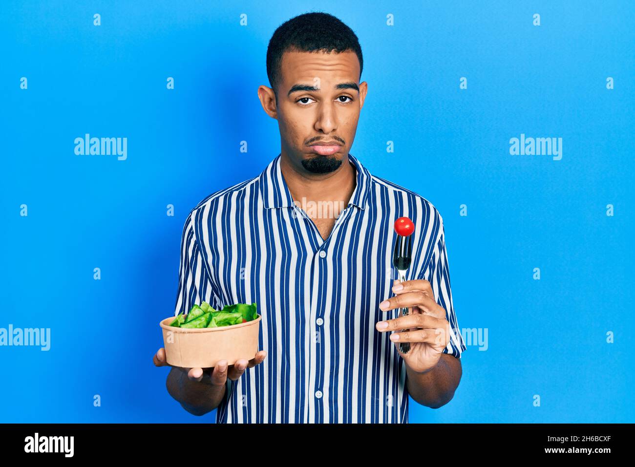 Man eating salad sad hi-res stock photography and images - Alamy